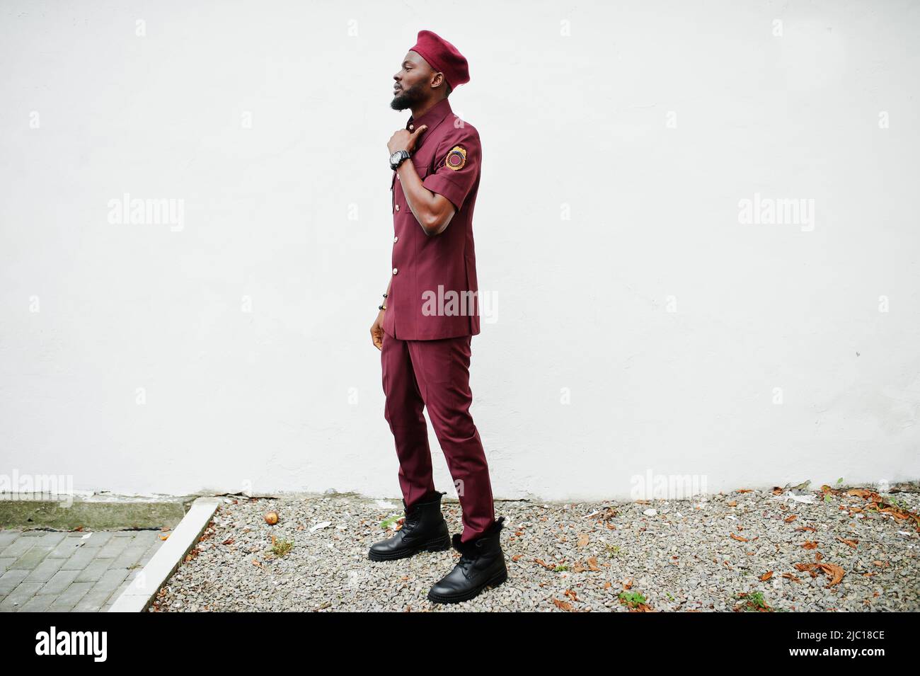 Portrait of African American military man in red uniform and beret ...