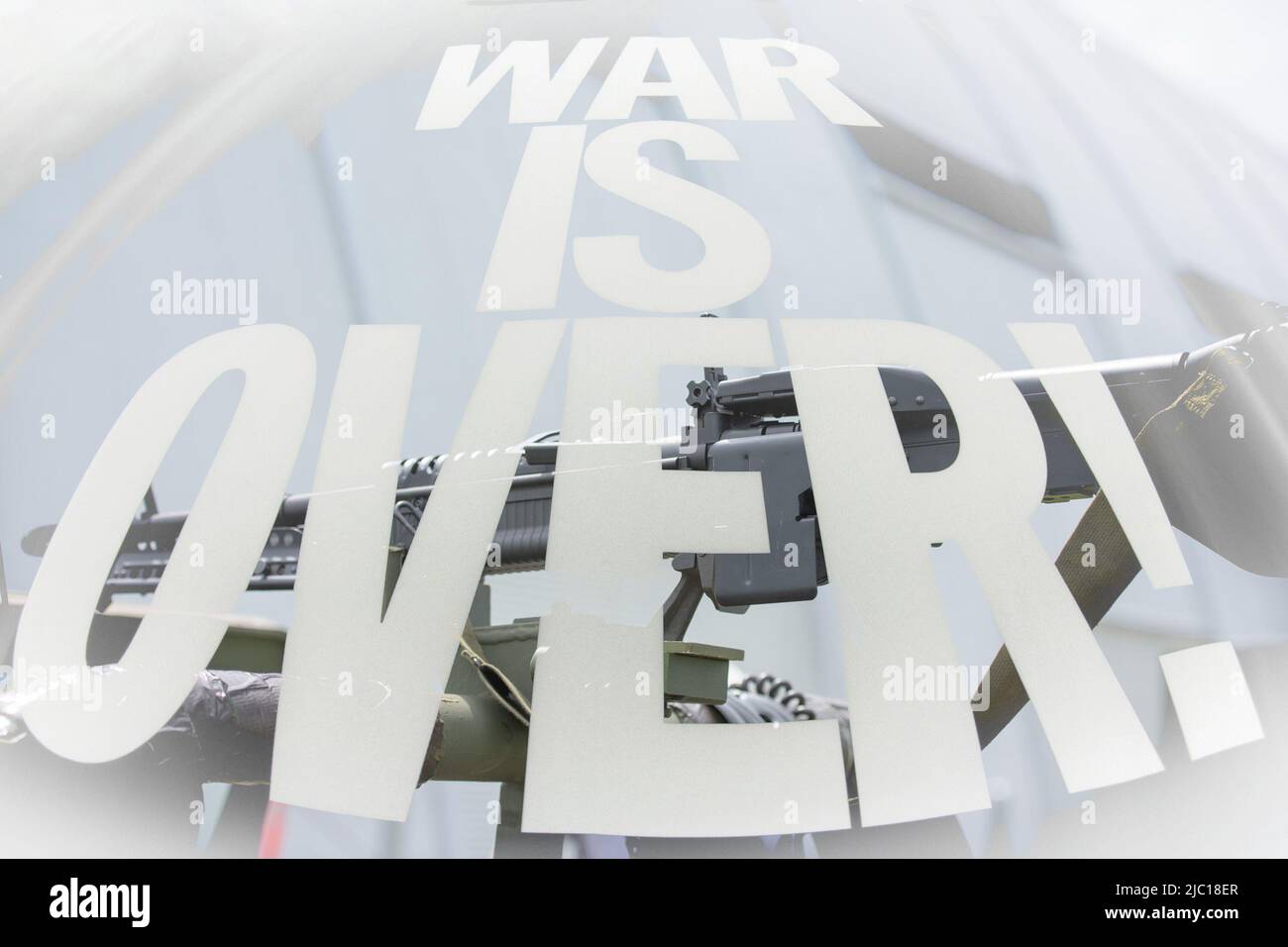 War is over writing white on machine gun background Stock Photo - Alamy