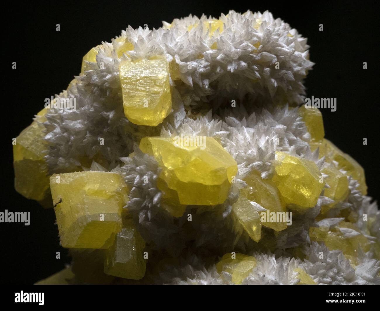 Sulfur and quartz gems stone isolated on black Stock Photo - Alamy