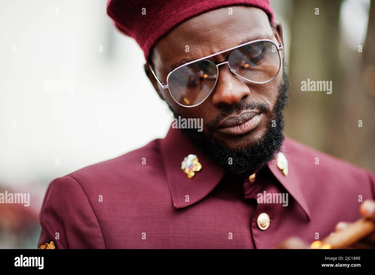 Portrait of African American military man in red uniform, sungalasses ...