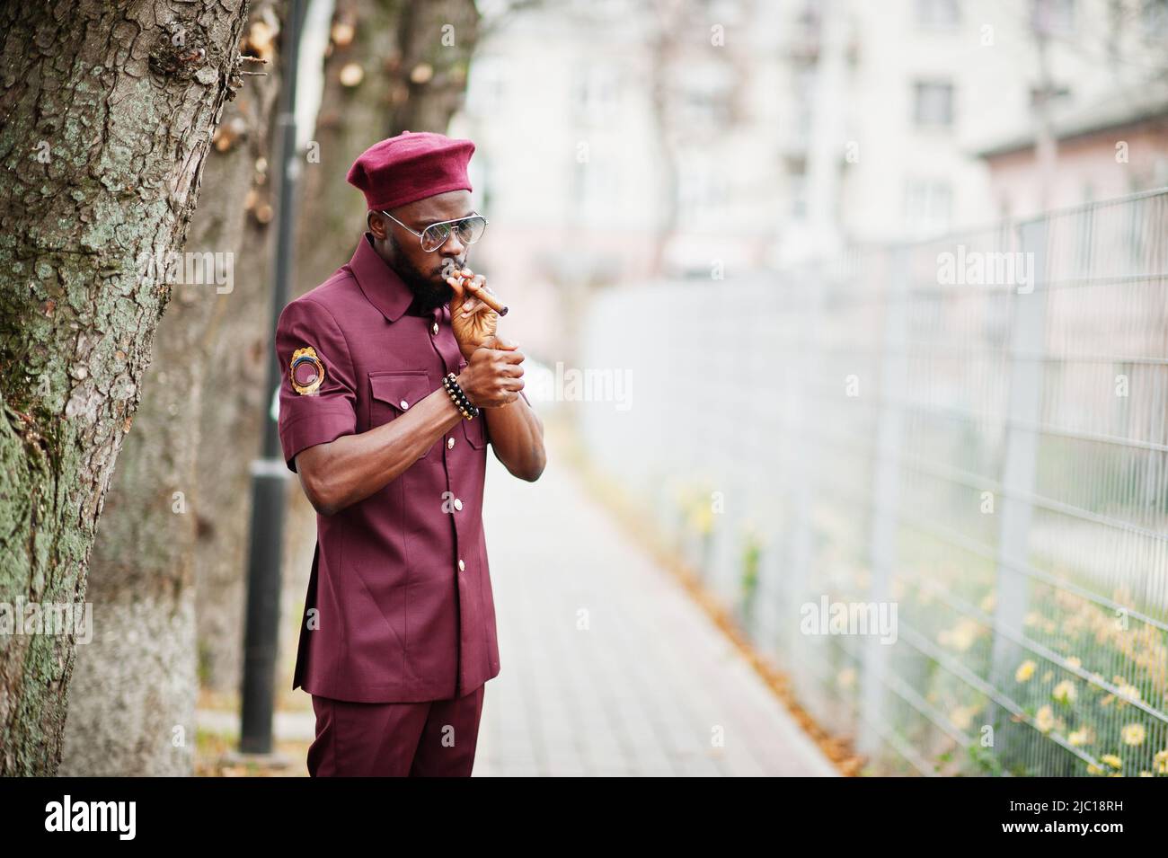 Portrait of African American military man in red uniform, sungalasses ...