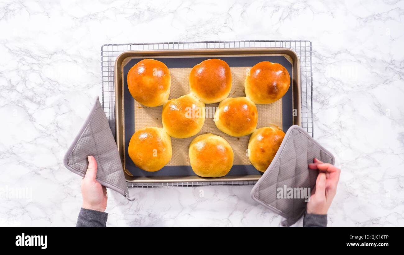 Flat lay. Step by step. Freshly baked brioche buns on a baking sheet ...