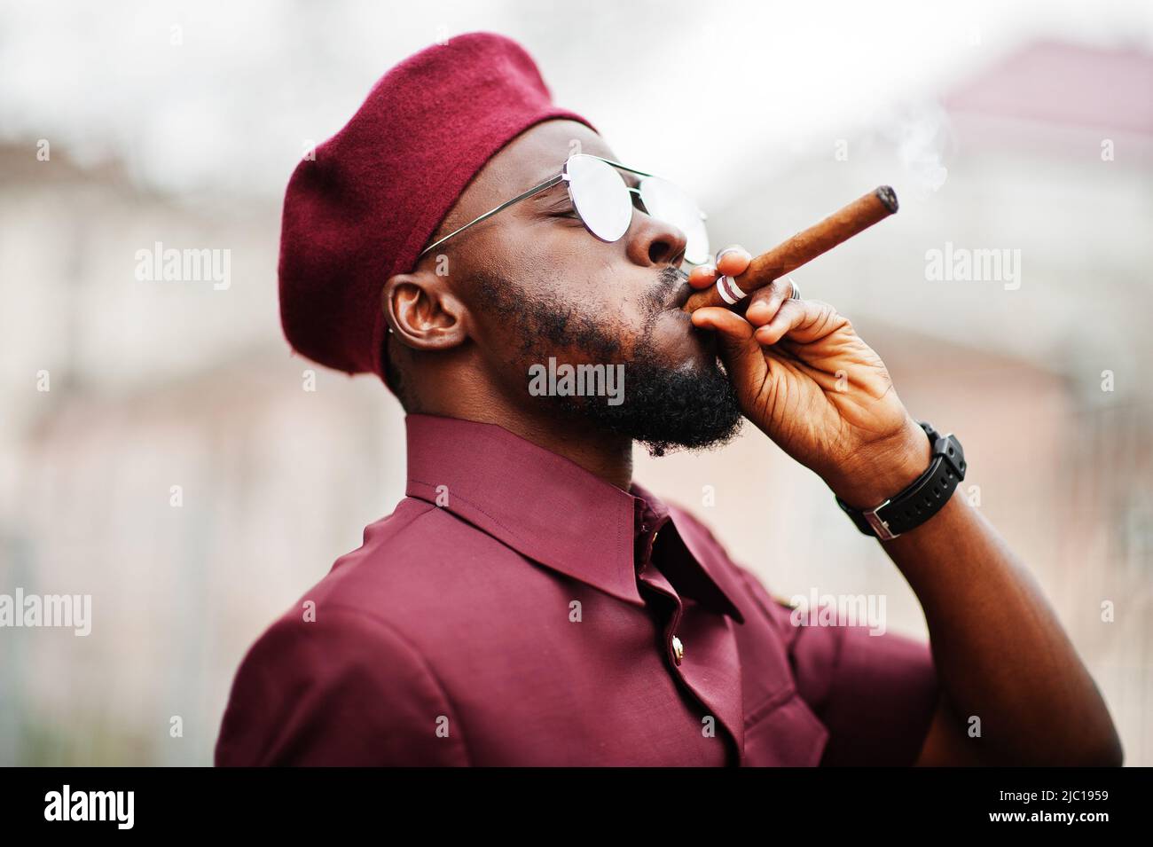 Portrait of African American military man in red uniform, sungalasses ...