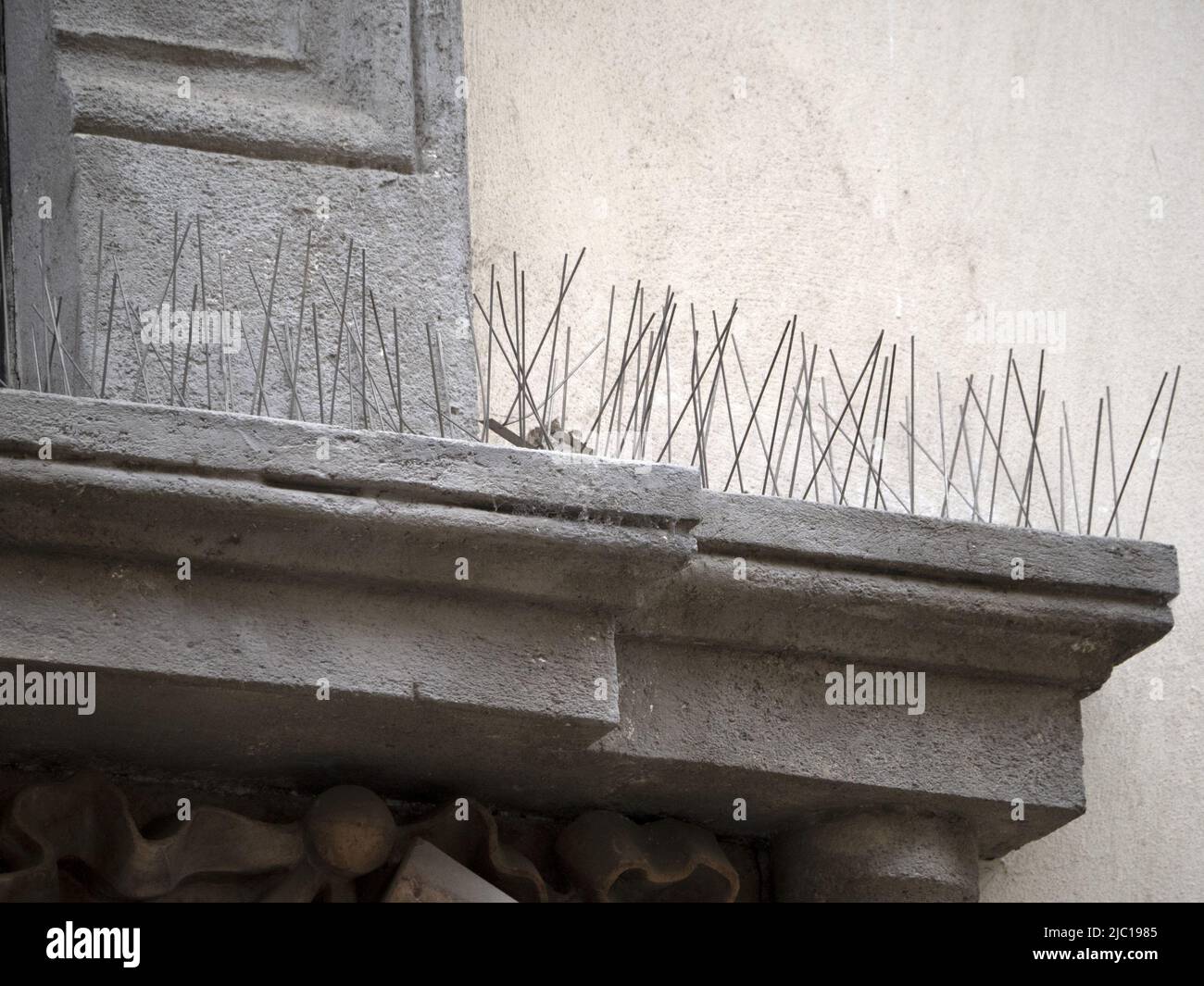 Anti No pigeon system on balcony detail Stock Photo - Alamy