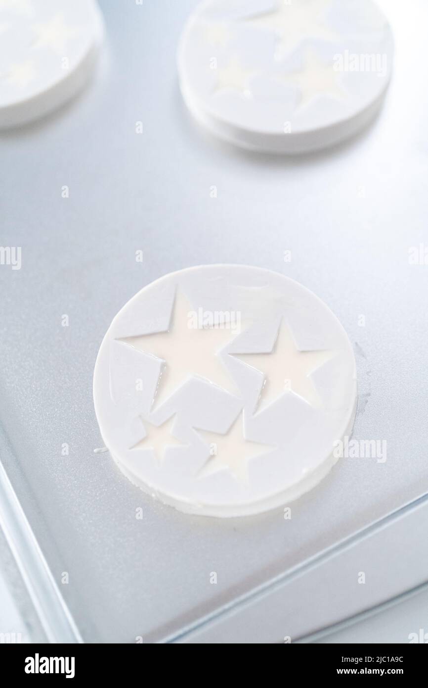 White chocolate stars in a silicone mold Stock Photo - Alamy