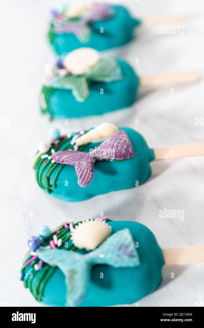 Mermaid cakesicles with drizzled chocolate, chocolate mermaid tails ...