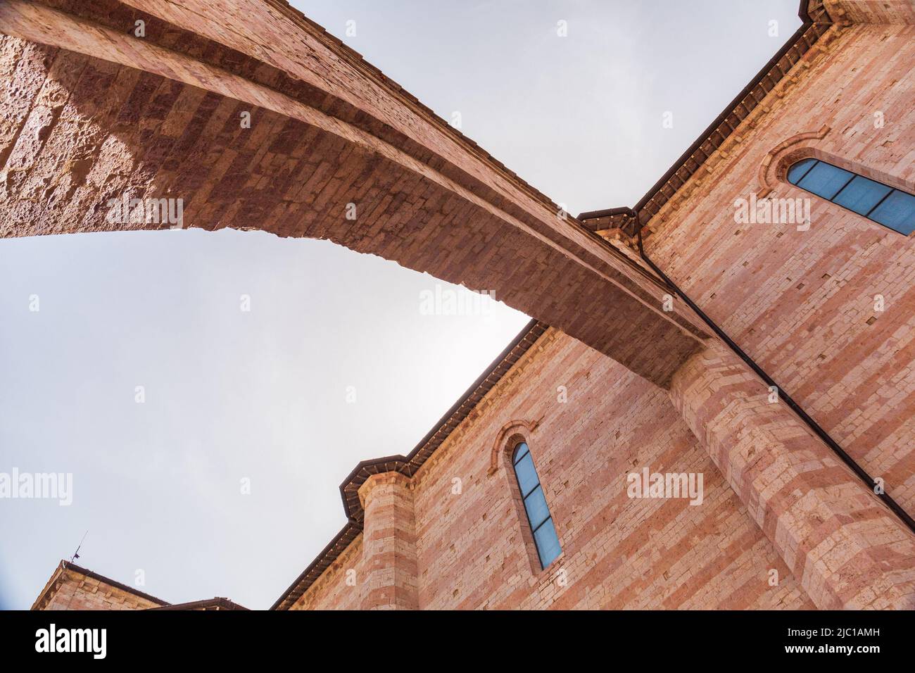 flying buttress of the Basilica of Santa Chiara in Assisi, Umbria ...