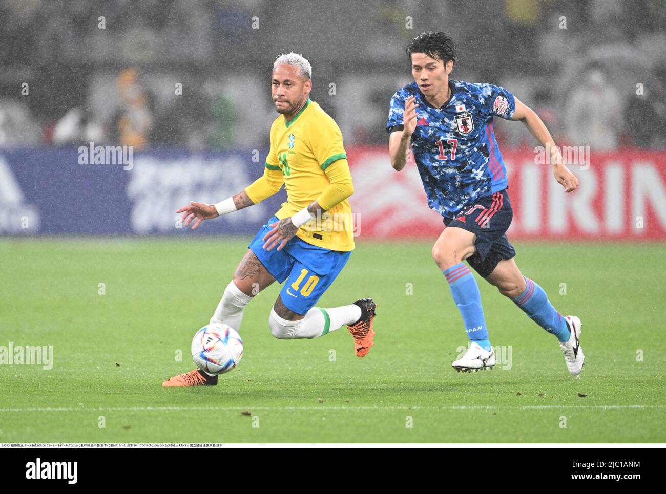 Neymar (10) of Brazil and Ao Tanaka (17) of Japan during the Kirin ...