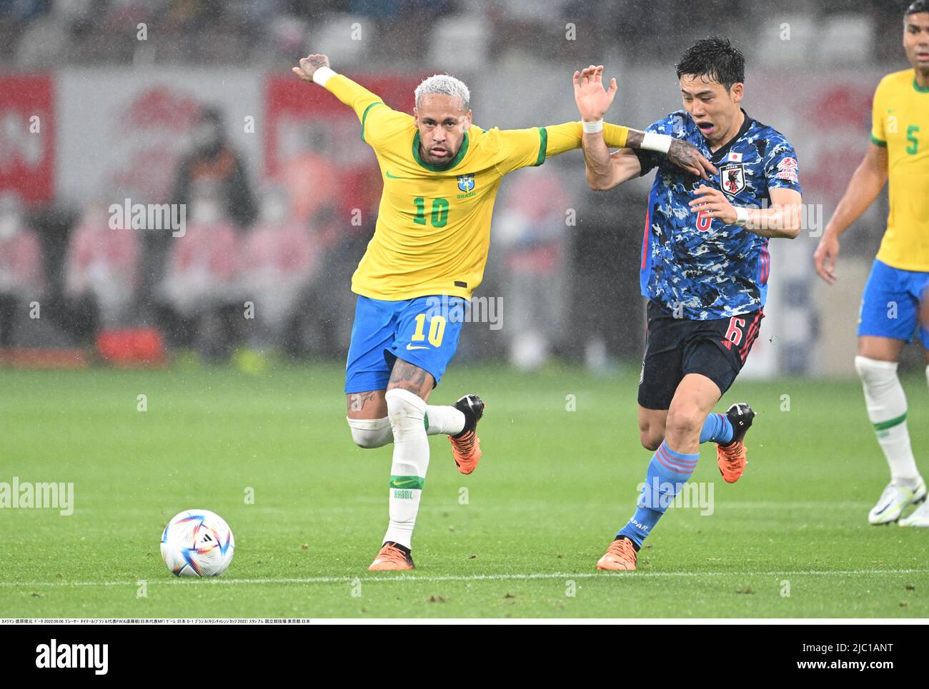 Neymar (10) of Brazil and Wataru Endo (6) of Japan during the Kirin ...