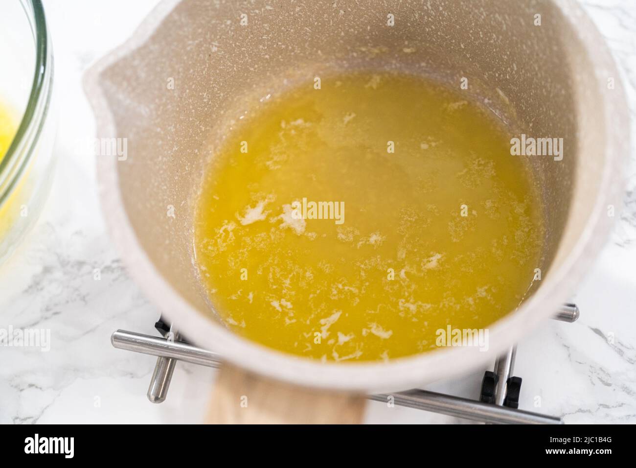 Melted sticks of unsalted butter on the counter Stock Photo - Alamy