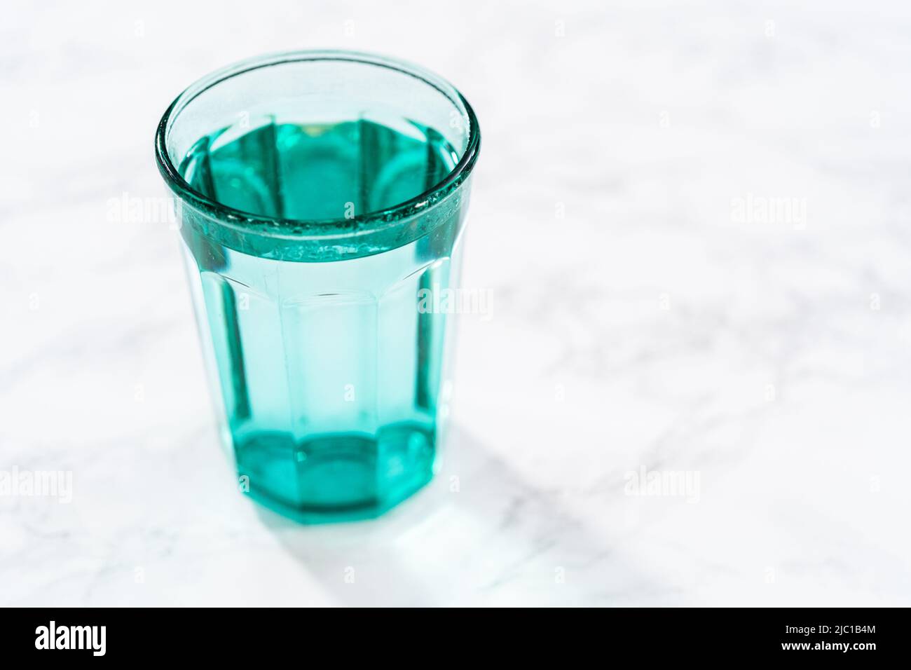 Softening stick of unsalted butter under a hot glass Stock Photo - Alamy