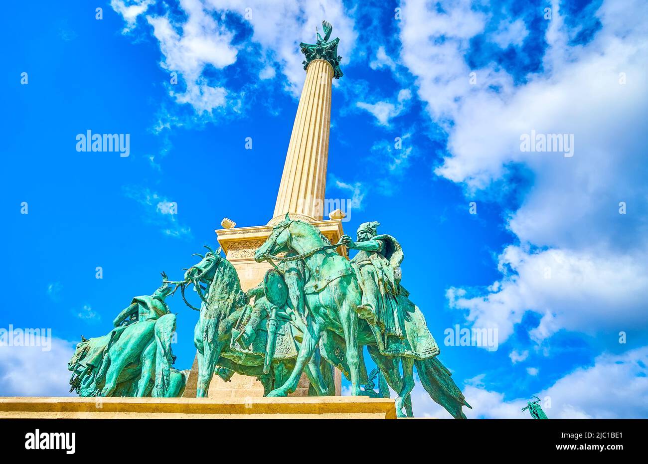 Millennium Monument with bronze statues and tall stone column on Heroes ...