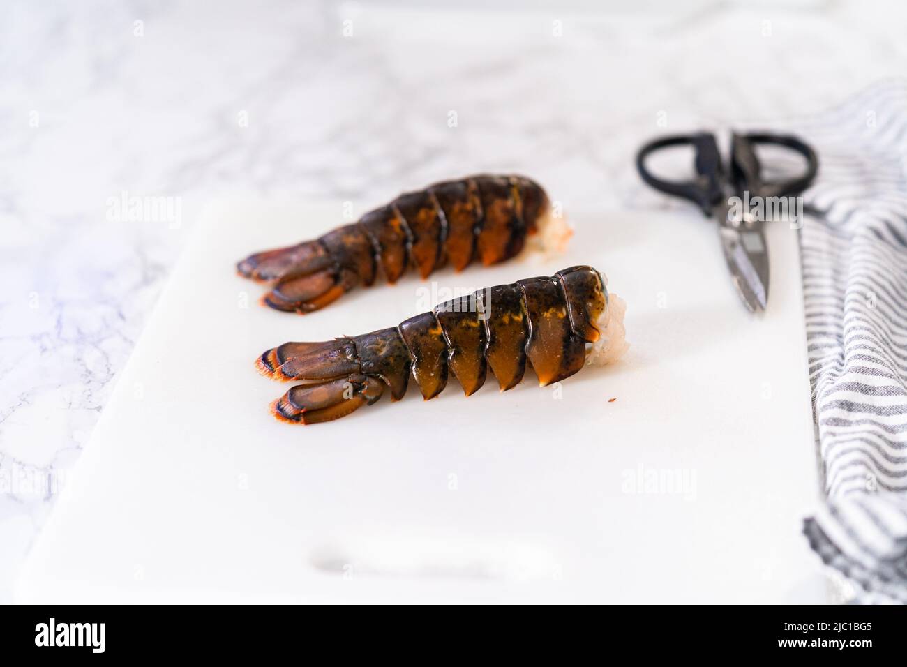 Preparing raw lobster tails to make garlic lobster tails Stock Photo ...