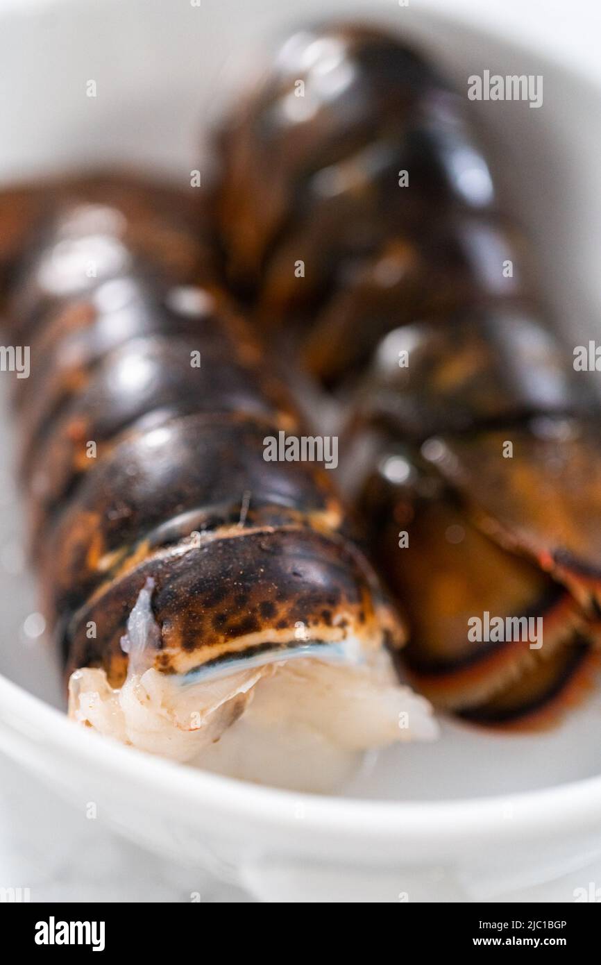 Preparing raw lobster tails to make garlic lobster tails Stock Photo ...