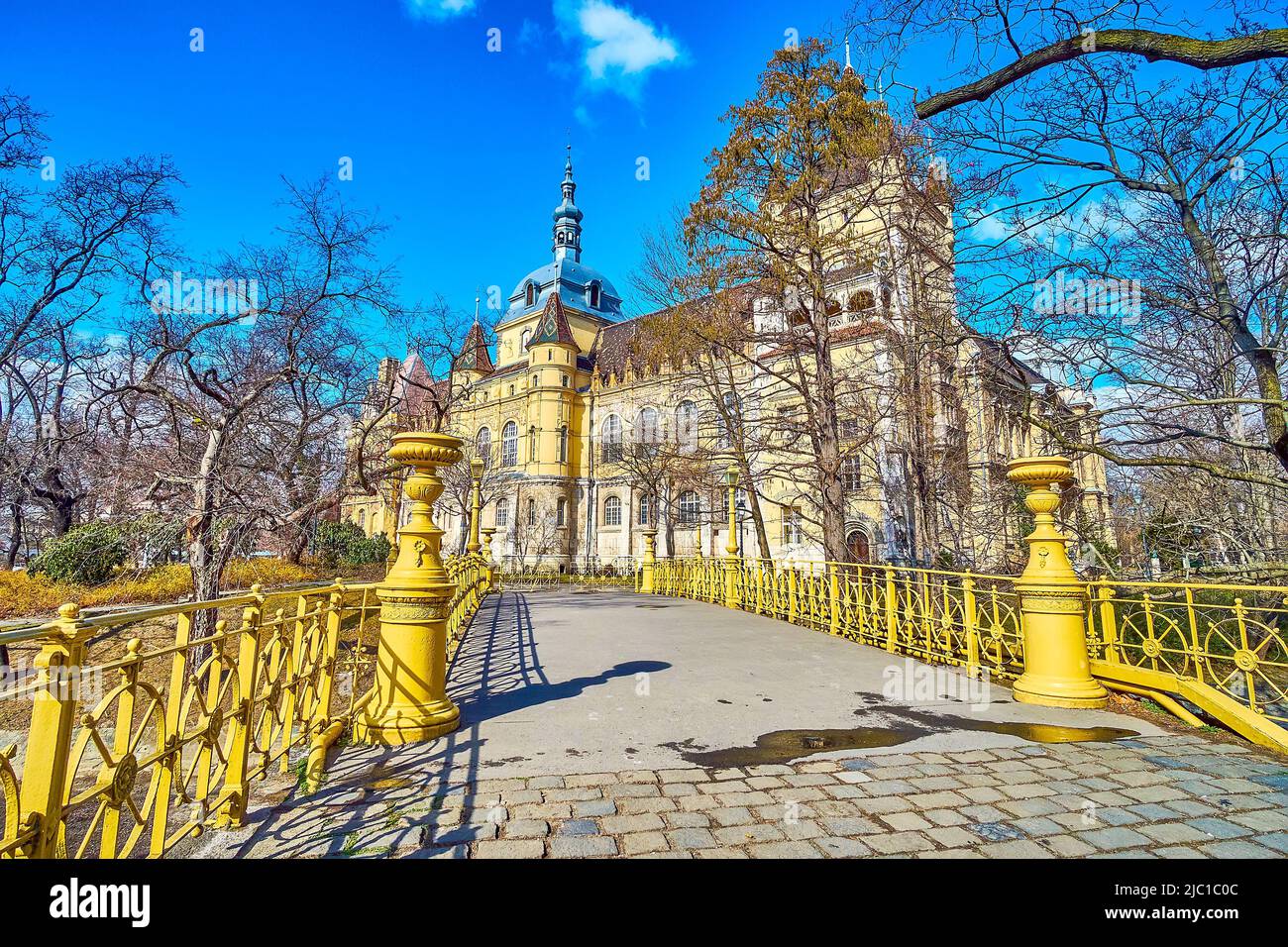 Passing the yellow bridge in City Park and visit Vajdahunyad Castle ...