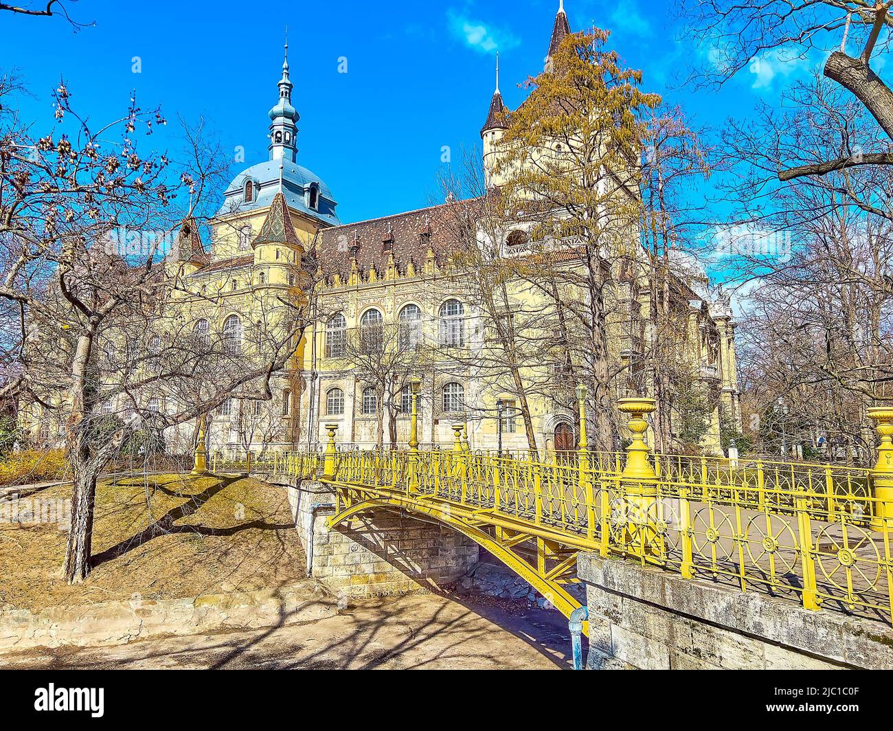 The yellow bridge connecting City Park and outstanding Vajdahunyad ...
