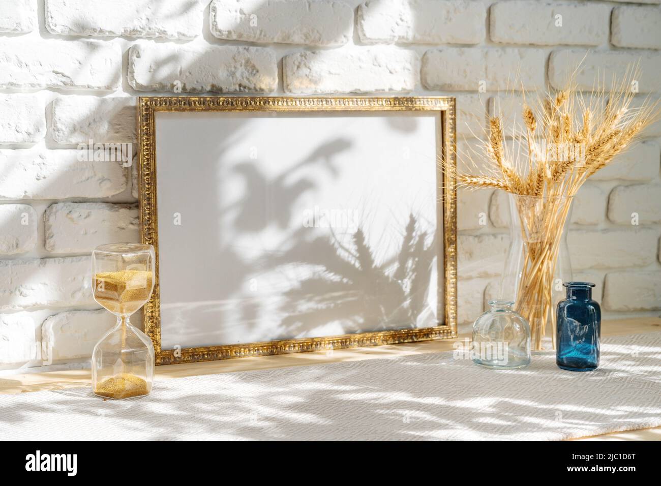 Photo frames on a brick wall background on the table with wheat ears in ...