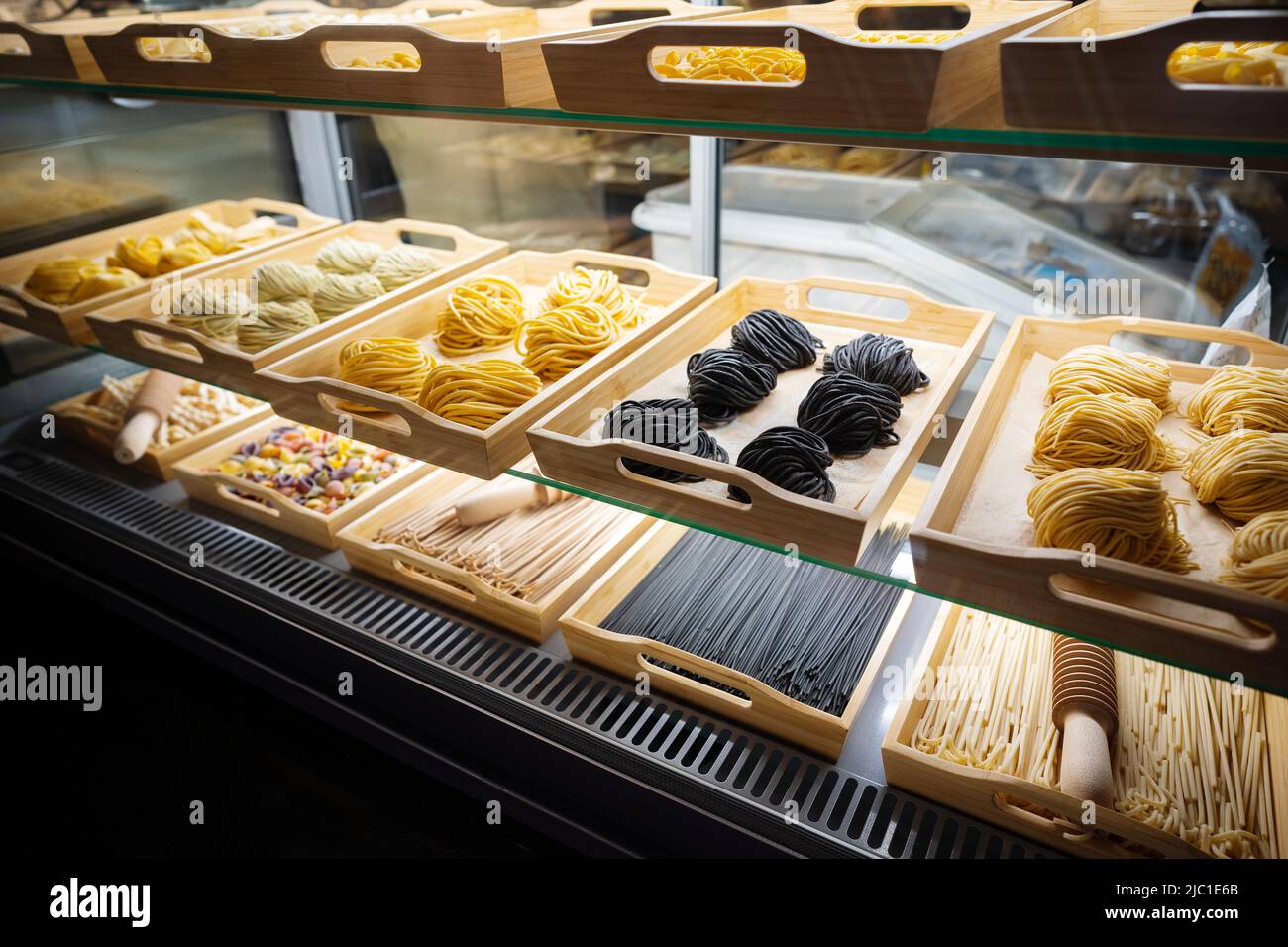 Italian fresh made colorful pasta in shop window Stock Photo - Alamy