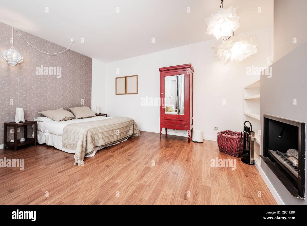 Double room decorated with wallpaper, red painted wardrobe with mirror ...