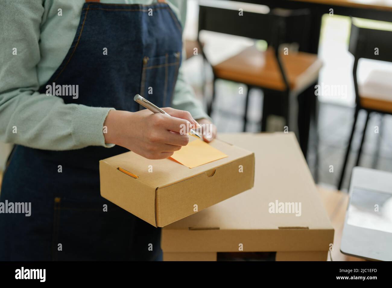 Shipping shopping online, startup small business owner writing address ...