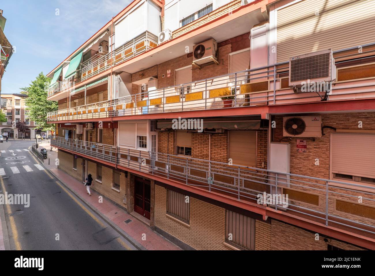 Facade of urban residential apartment buildings with terraces and ...