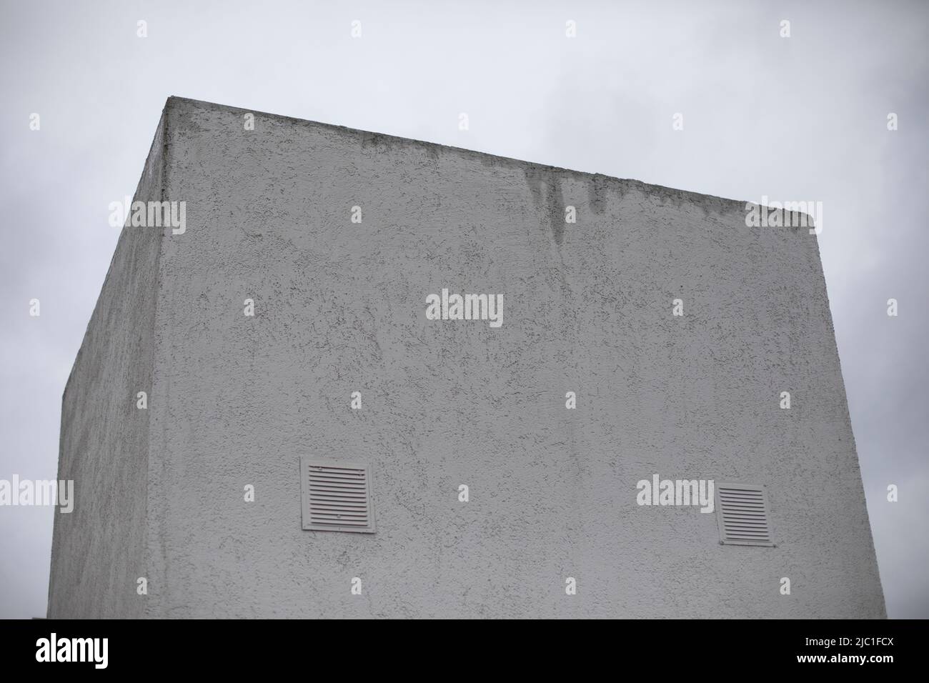 Grey building with no windows. Urban infrastructure. Hot air removal ...
