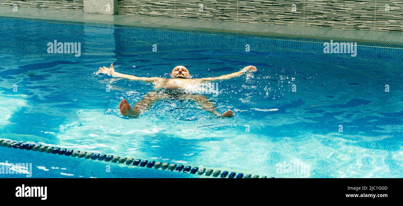 Fat man float pool hi-res stock photography and images - Alamy