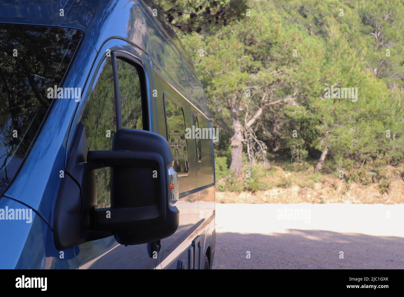 a blue camper van side view Stock Photo - Alamy
