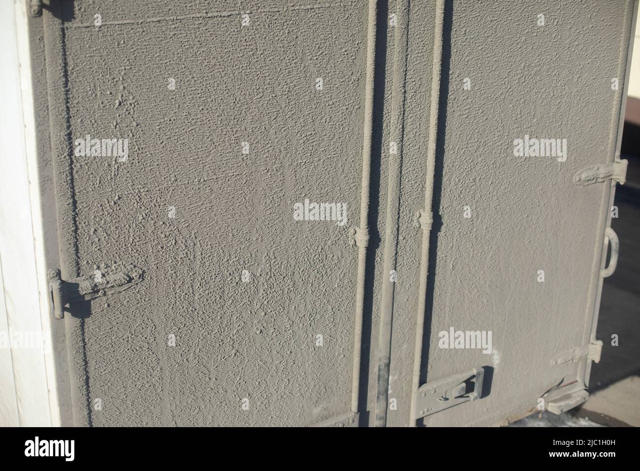 Dust on back of truck. Dirty truck. Transport details. Doors at back ...