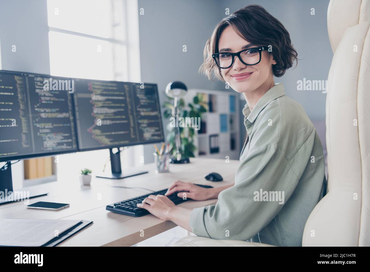 Profile side picture of positive business lady working hard writing ...