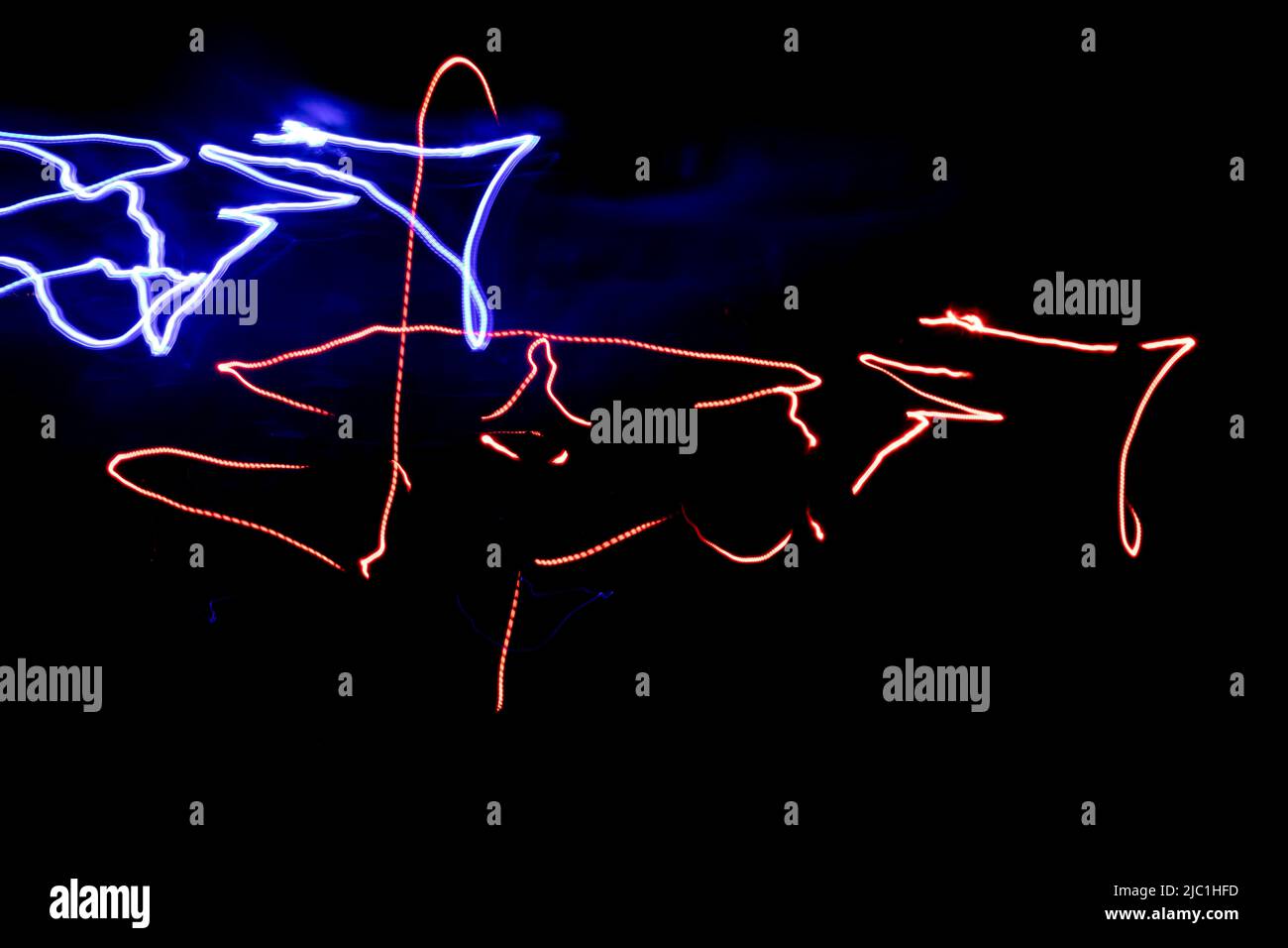 Chaotic lines in dark. Neon glow. Texture of bright lines. Glow on ...