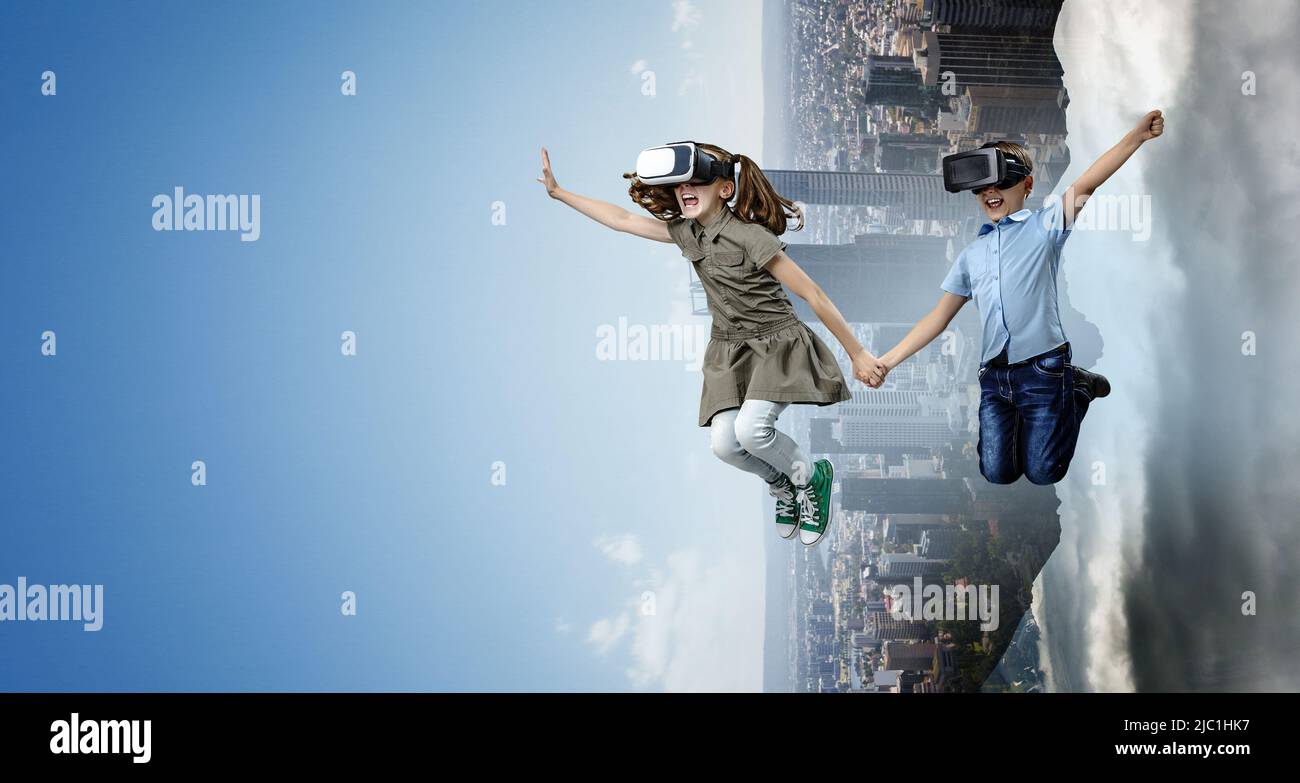 Kids wearing virtual reality goggles Stock Photo - Alamy