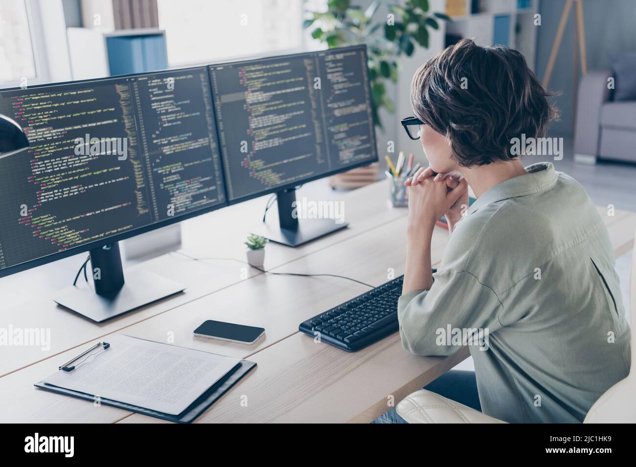 Back view photo of smart professional woman web-designer thinking try ...