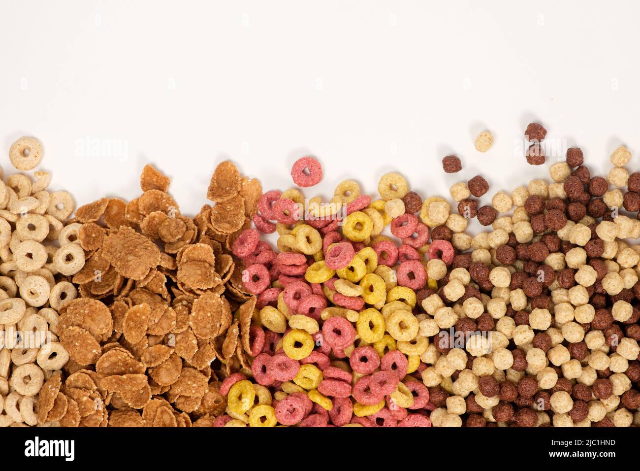 A set of different quick breakfast cereals - rings and balls, top view ...