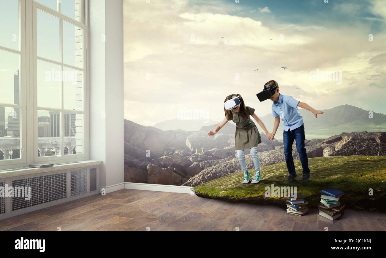 Kids wearing virtual reality goggles Stock Photo - Alamy