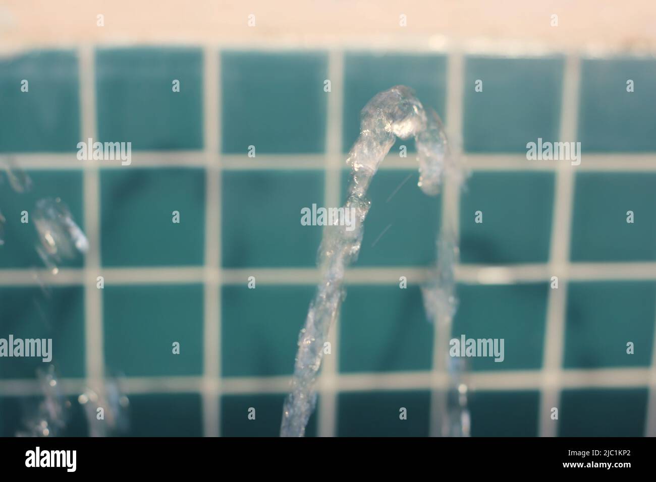 A stream of water spurting out of a calm and relaxing tropical garden ...