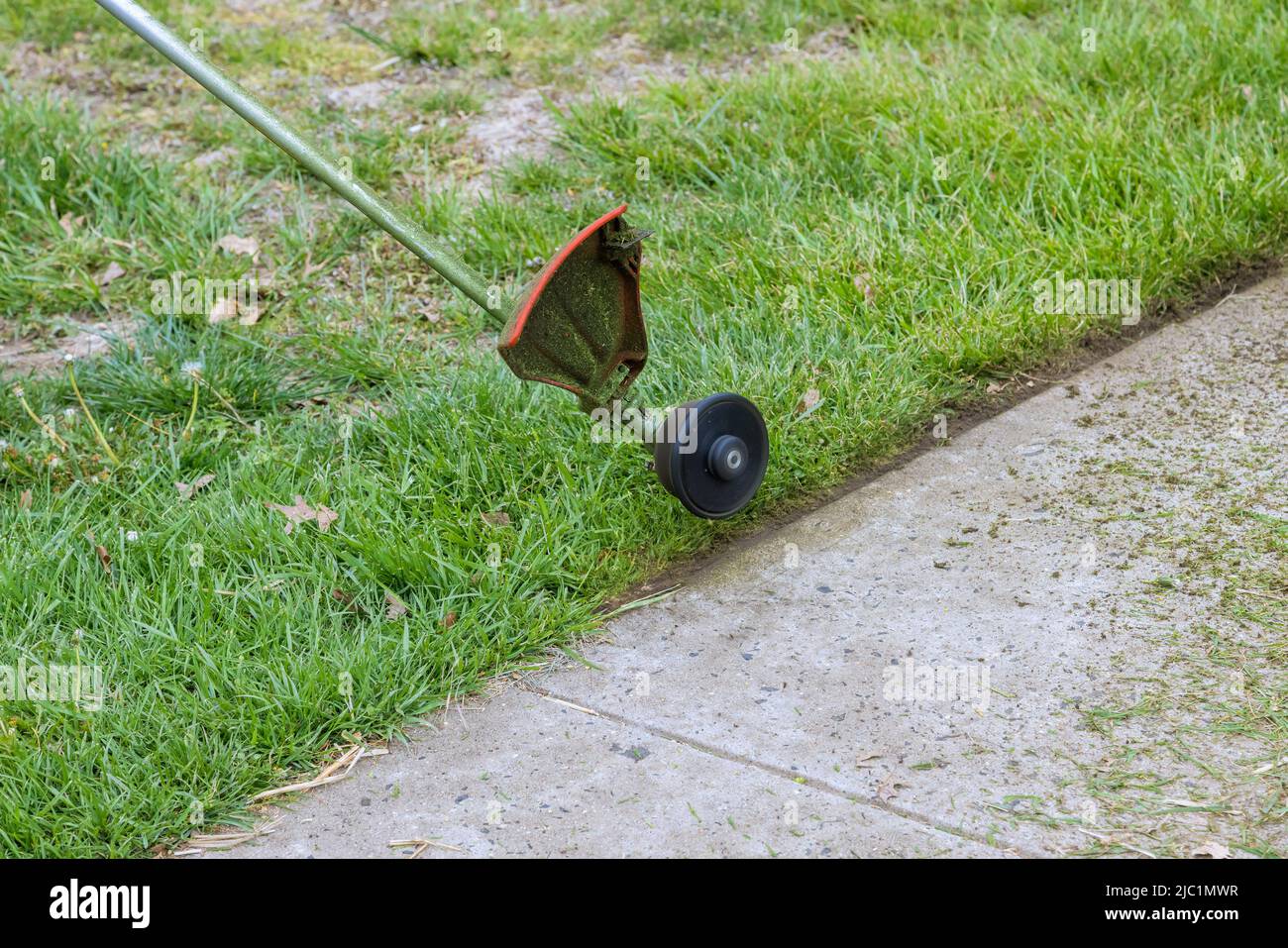 Gardener cutting grass hi-res stock photography and images - Alamy