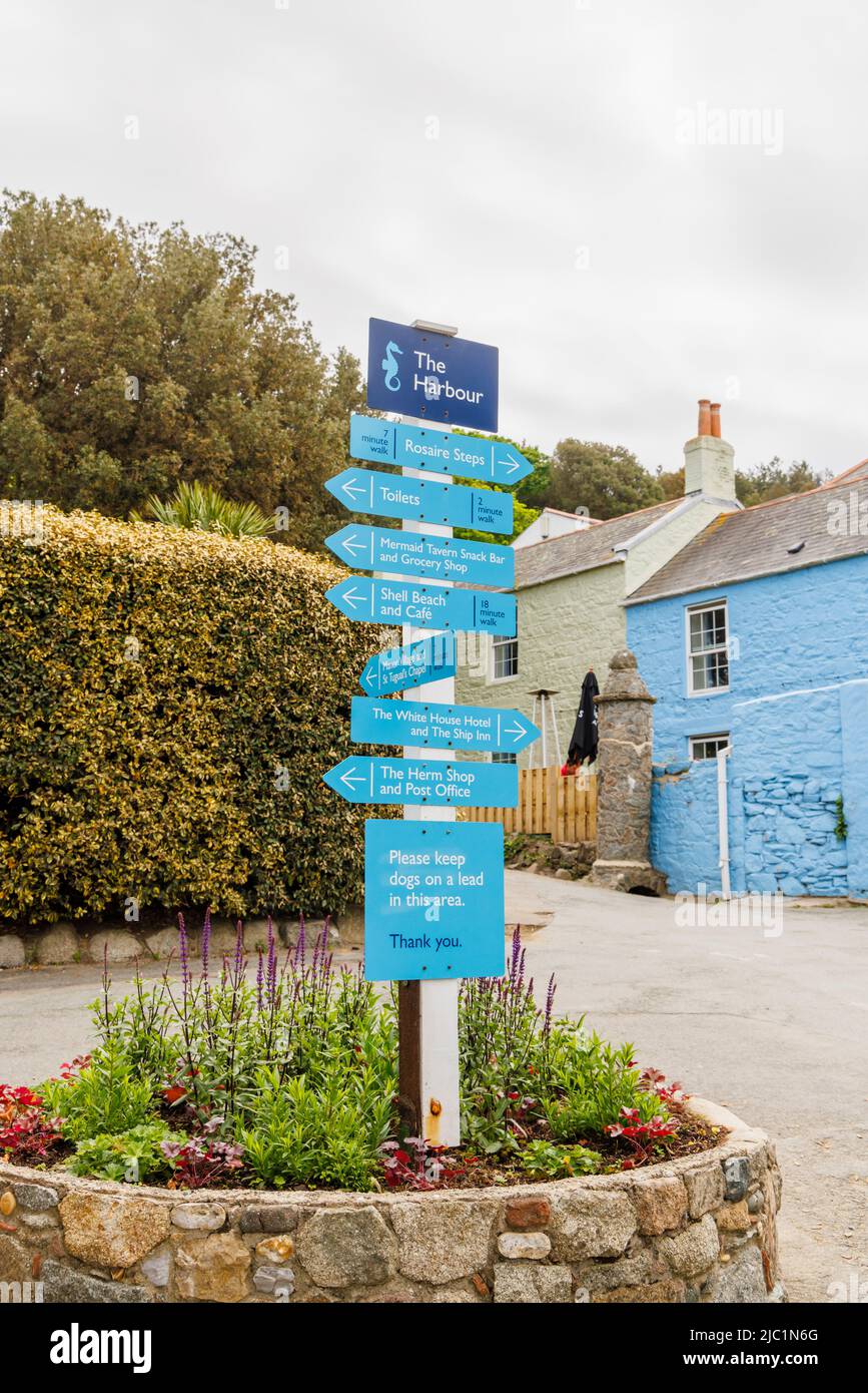 Blue finger post signpost in the Harbour with directions to the ...