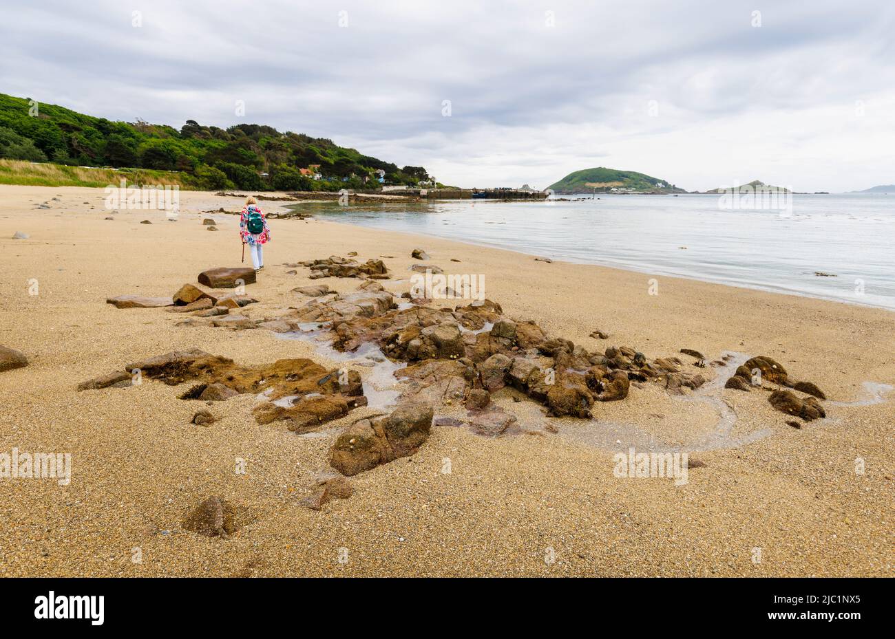 Fisherman's Beach looking towards the Harbour and Jethou island on the ...