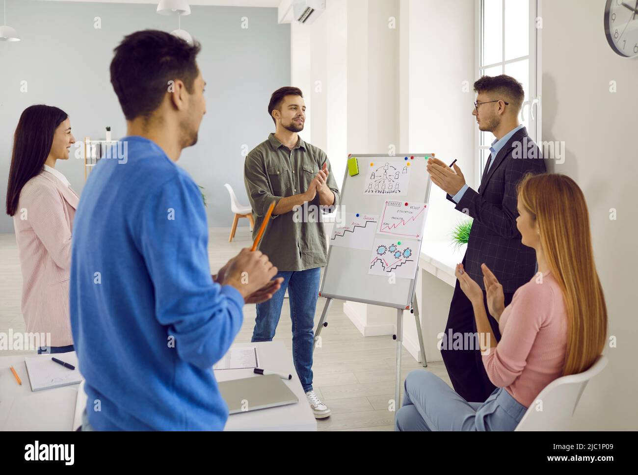 Smart young people discuss ideas for new development strategy at white ...