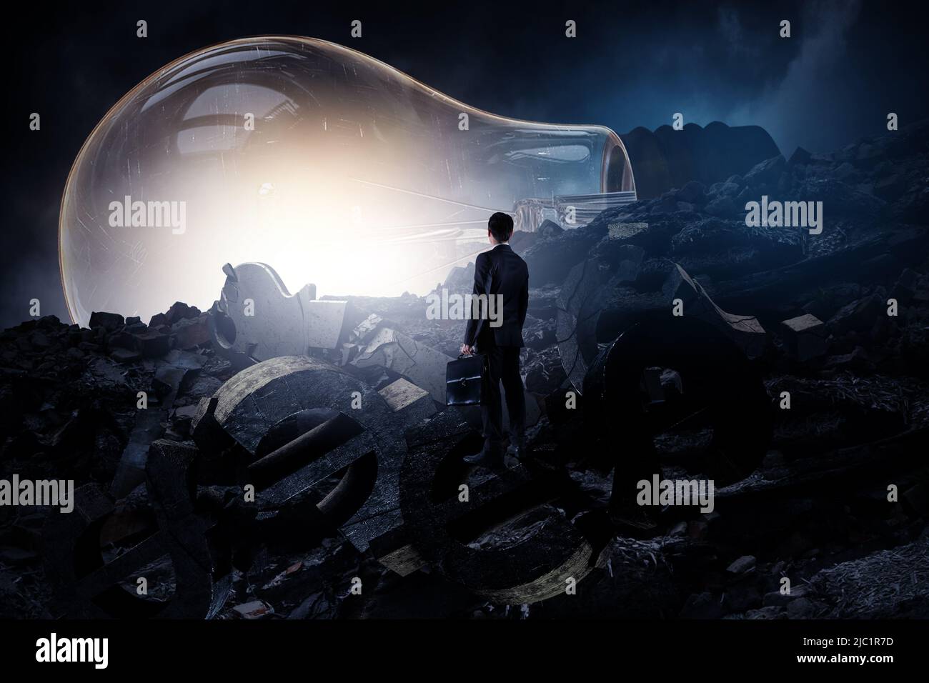 Huge light bulb glowing in the darkness Stock Photo - Alamy