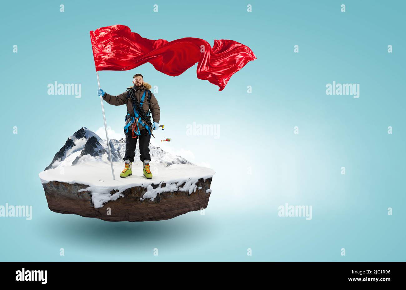 Mountaineer with a red flag Stock Photo - Alamy