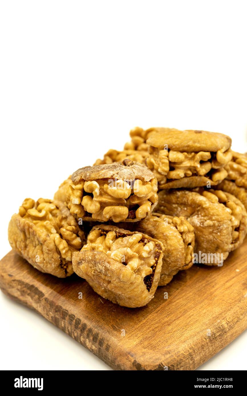 Stuffed dried figs. Dried figs stuffed with walnuts isolated on white ...