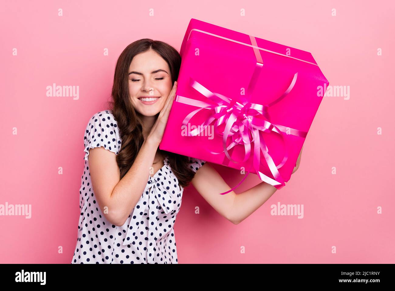 Photo of dreamy pretty lady dressed dotted dress rising big present box ...