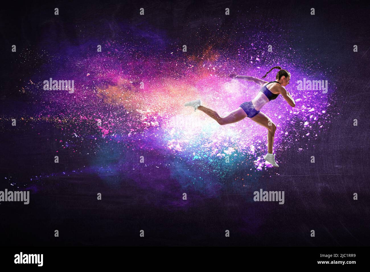 Athletic woman runner on colourful background Stock Photo - Alamy