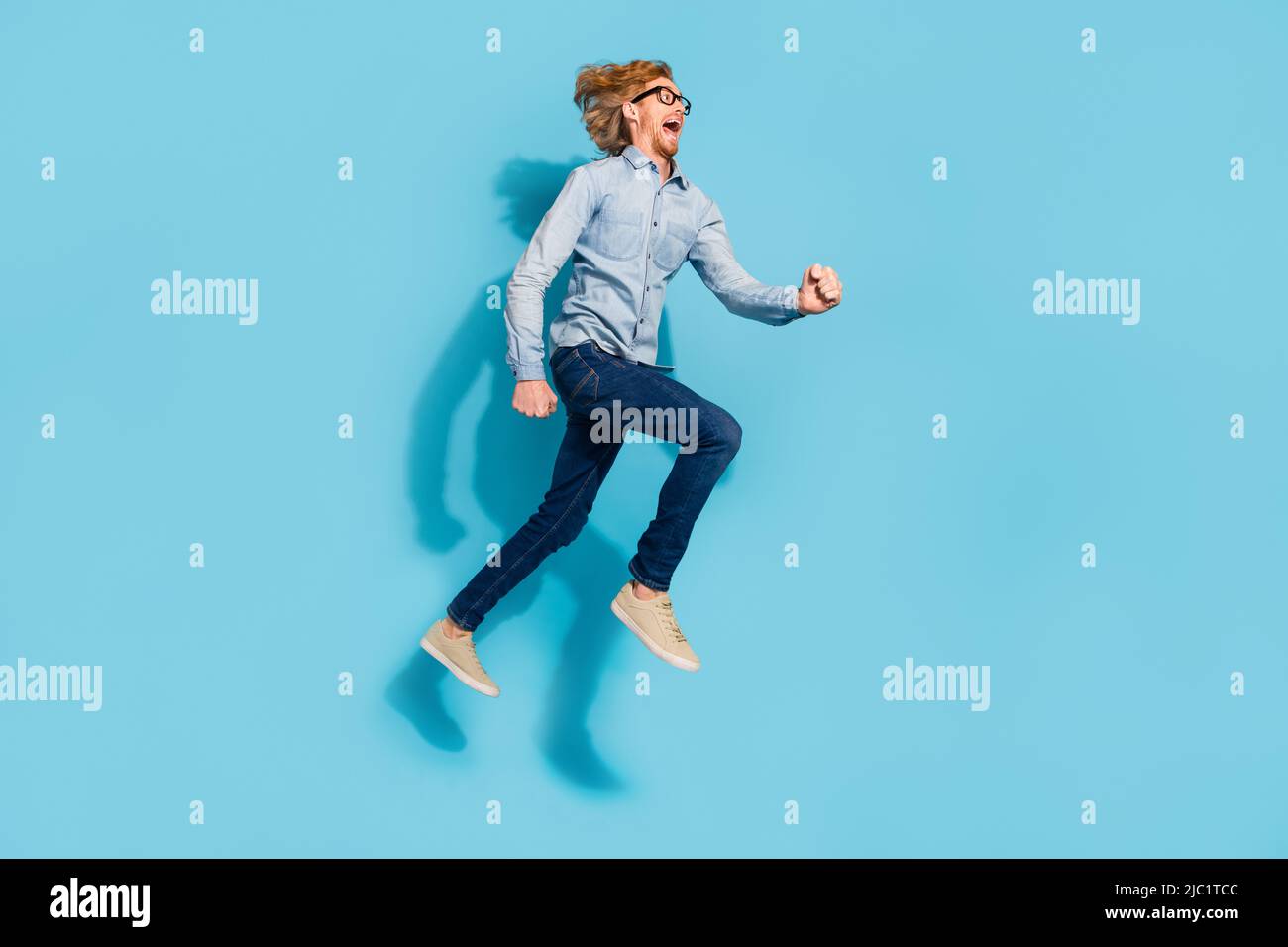 Full length photo of shocked excited young guy dressed jeans shirt ...