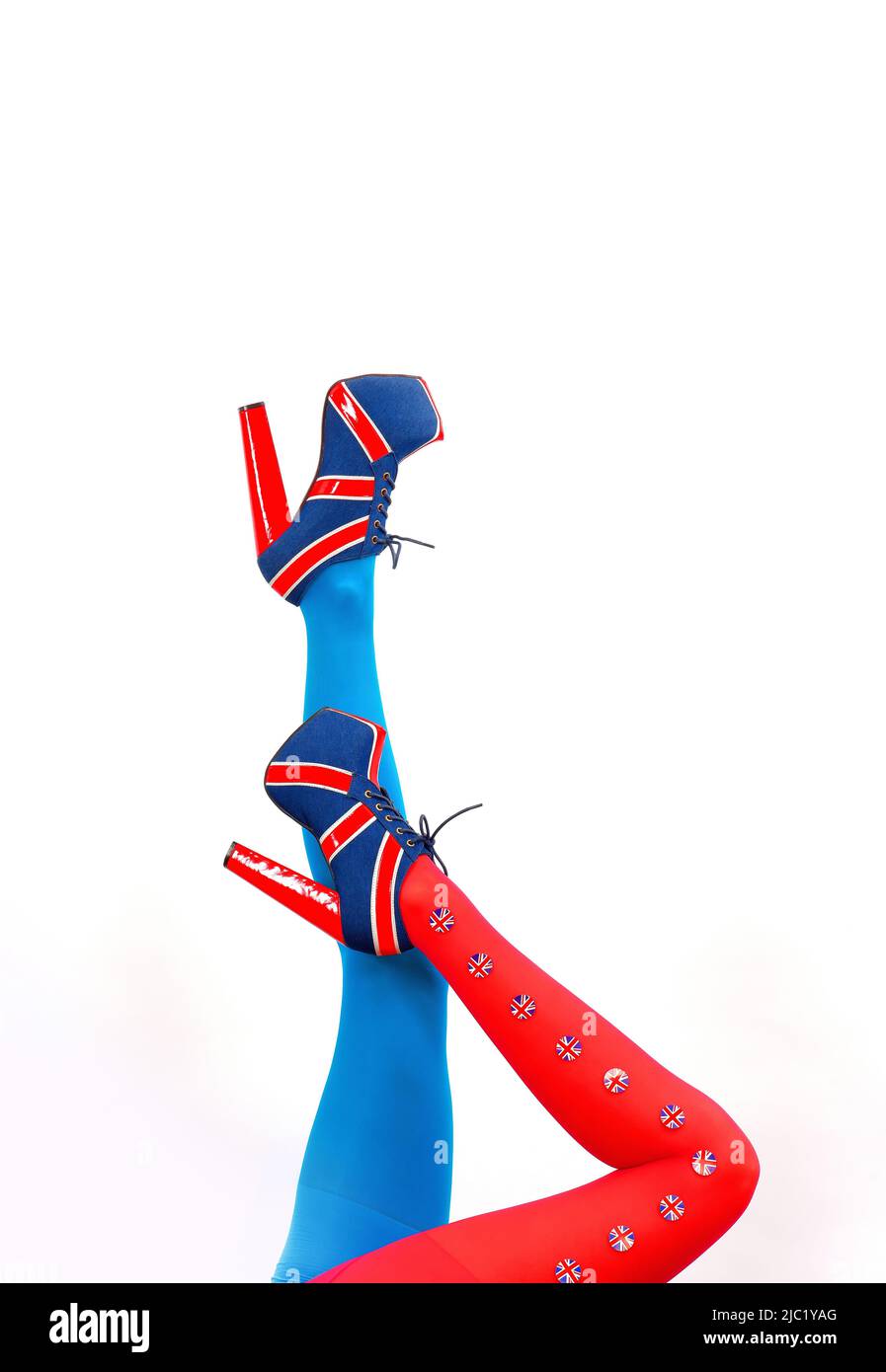 Female long legs are stretched out highup vertically. On them, stylish ...