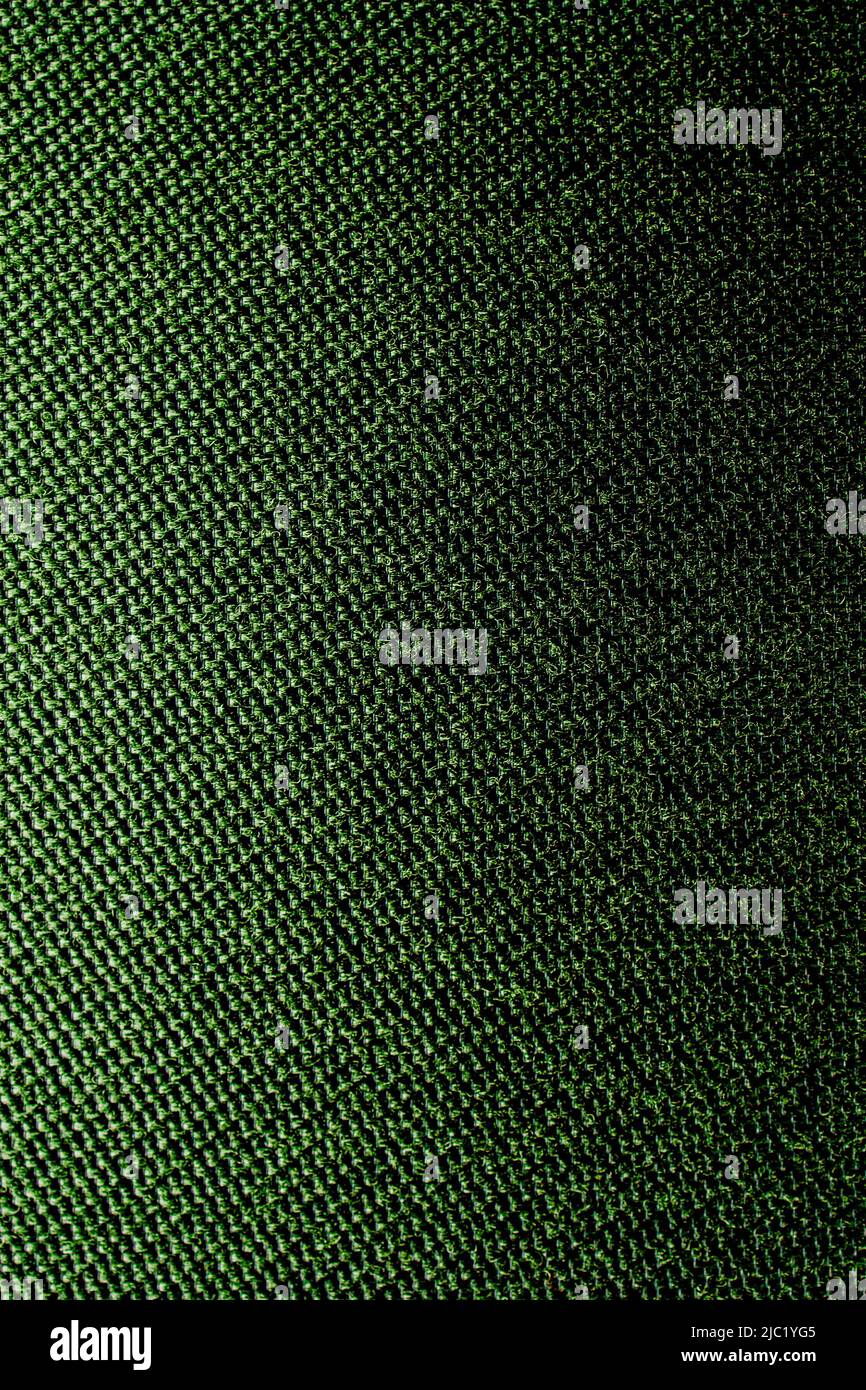 Dark green background of textile material with wicker pattern, close up ...