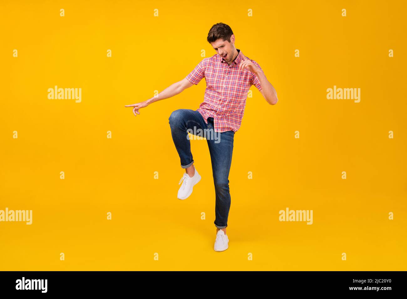 Full length photo of young man happy positive smile have fun dance ...