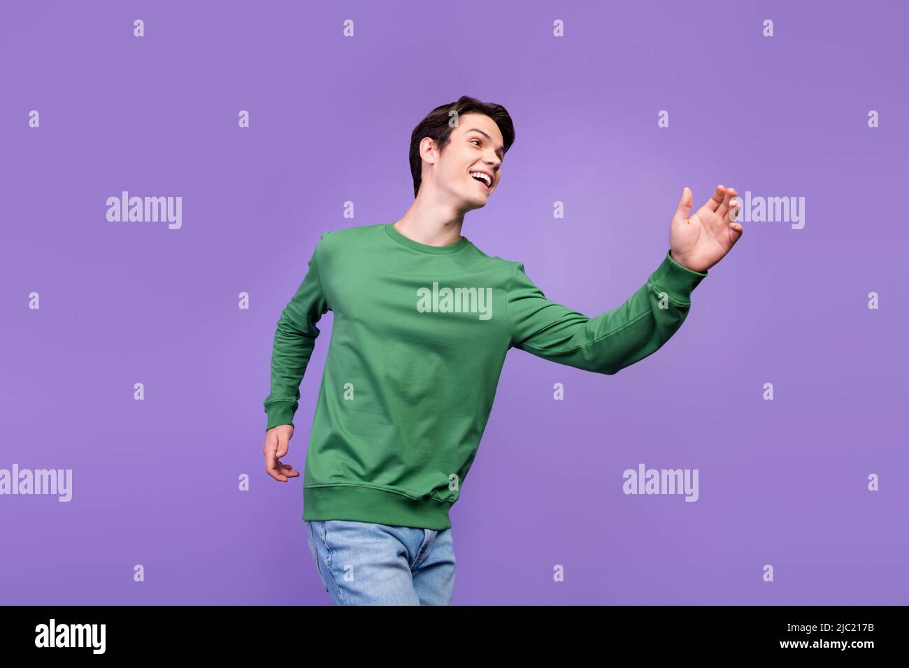 Low angle view photo of young guy happy positive smile go run hurry ...